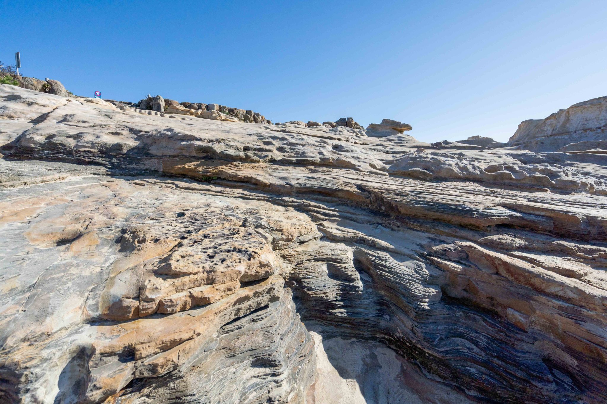 A large step-shaped rock formation created by waves and uplifts ...